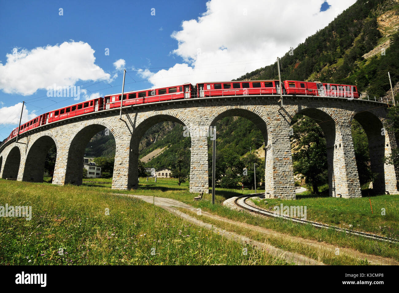 Swiss Red Train Bernina Express pass on Brusio Viaduct, Italy ...