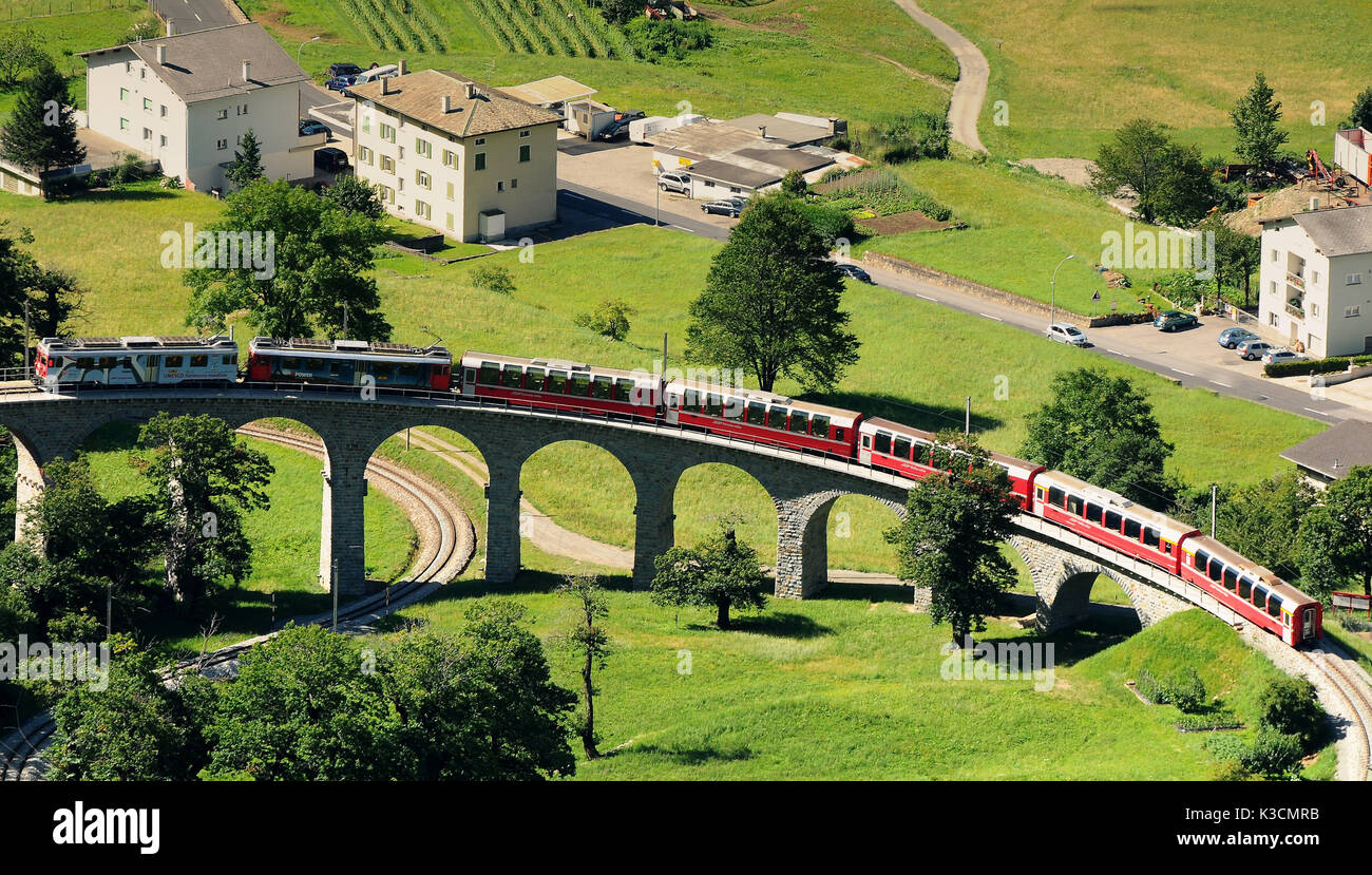 Swiss Red Train Bernina Express pass on Brusio Viaduct, Italy ...