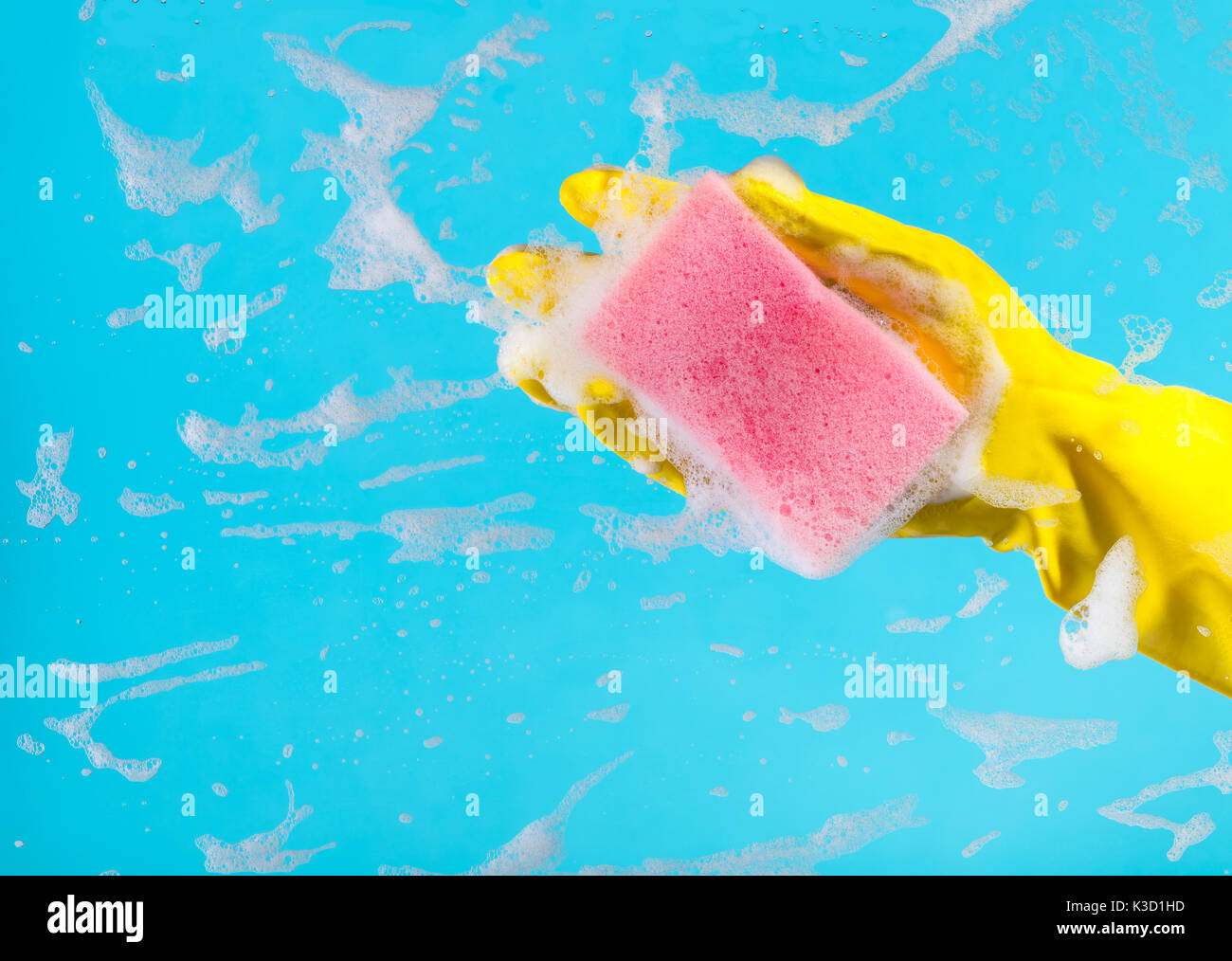 Cleaning conept, hand cleaning glass window pane with detergent and ...