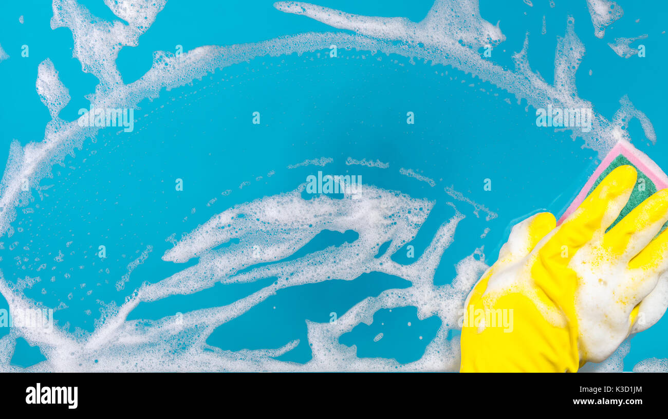 Cleaning conept, hand cleaning glass window pane with detergent and ...