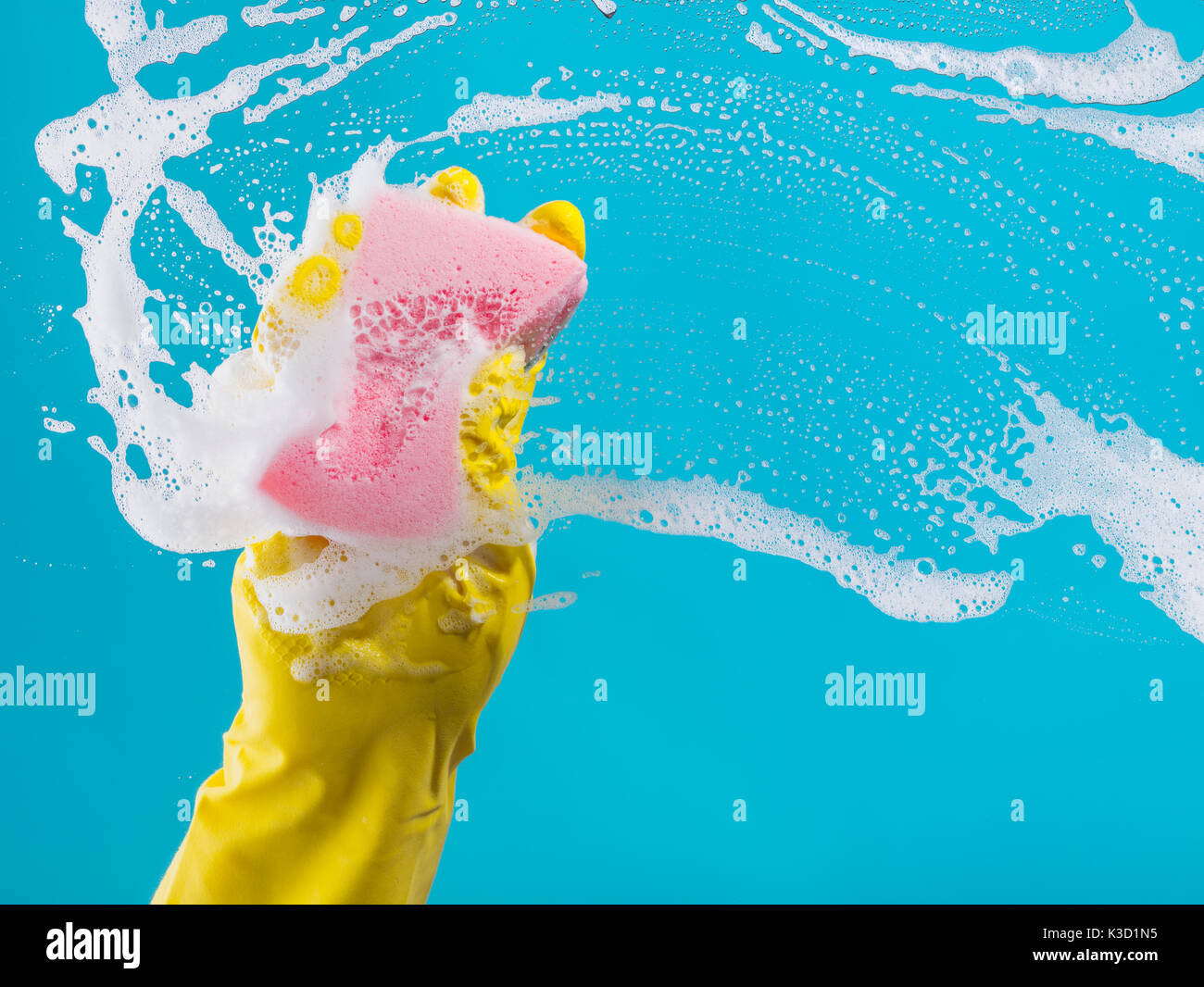 Cleaning conept, hand cleaning glass window pane with detergent and ...