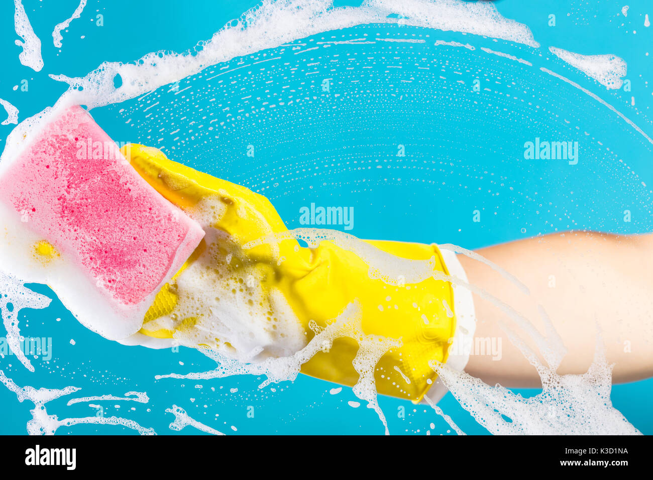 Cleaning conept, hand cleaning glass window pane with detergent and ...