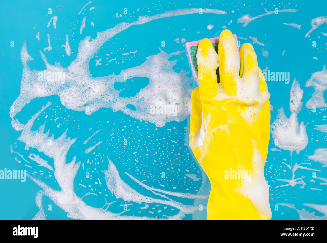 Cleaning conept, hand cleaning glass window pane with detergent and ...