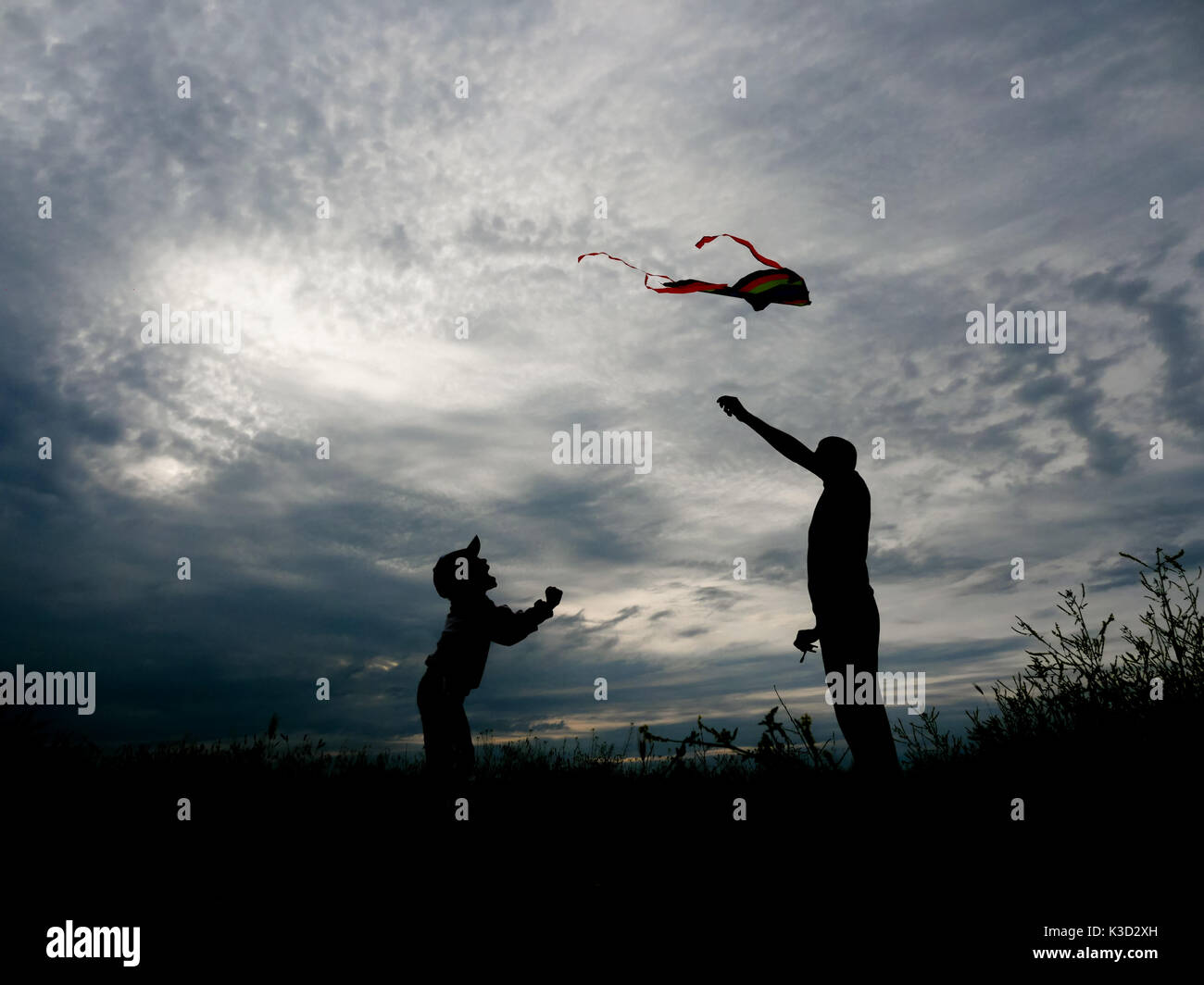Son launching kite hi-res stock photography and images - Alamy