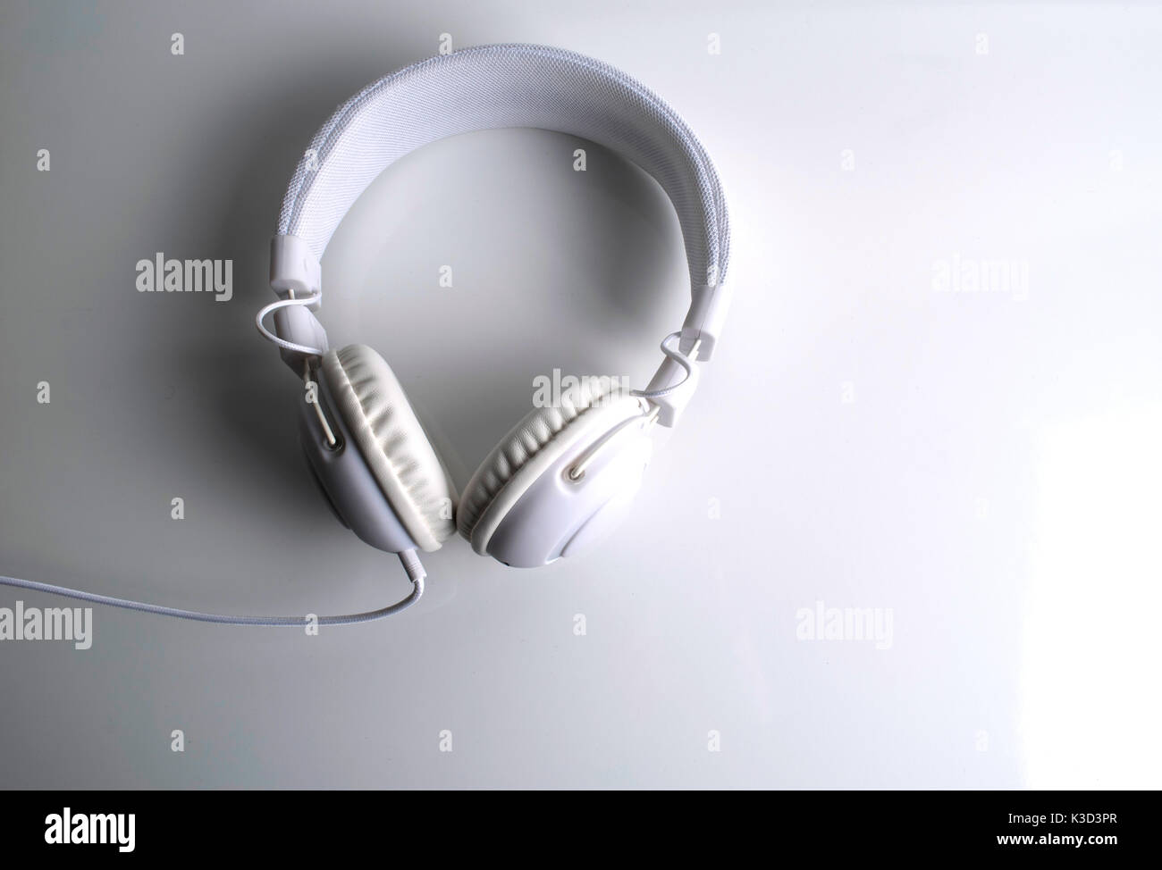 Isolated modern white headphone over a white reflected background Stock ...