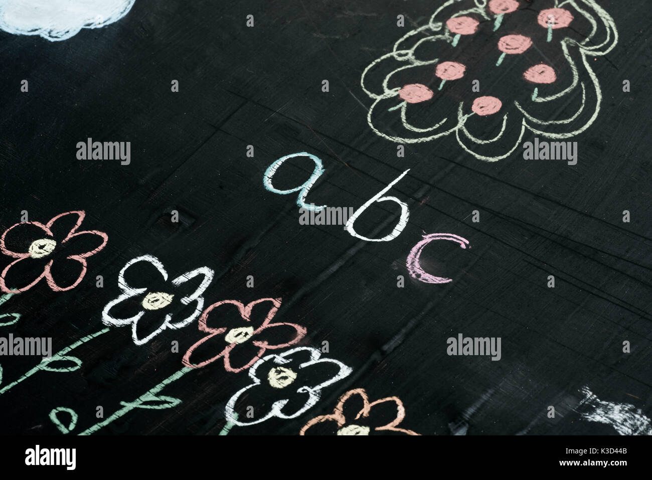 abc letters chalk drawing on blackboard background selective focus ...