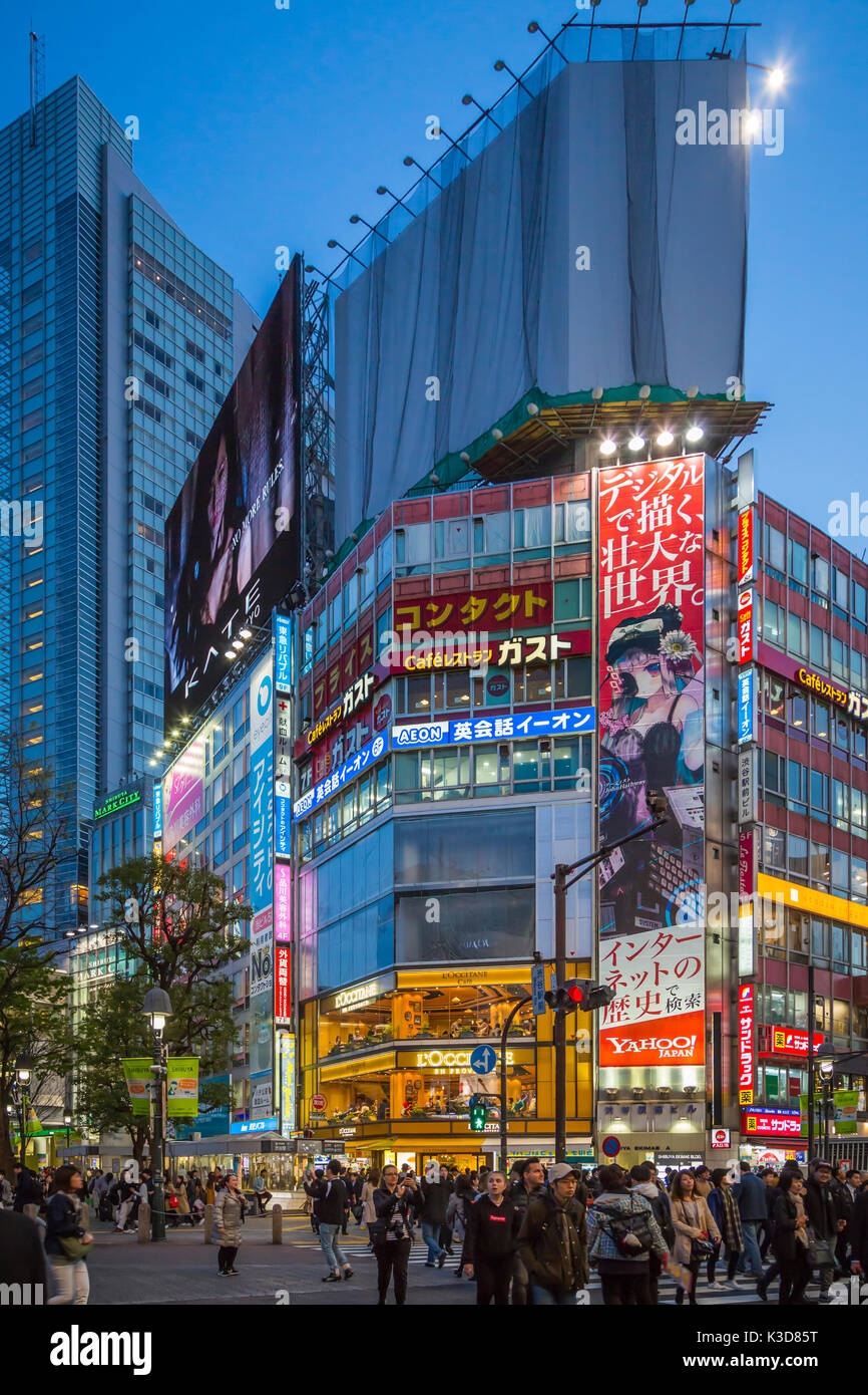The bright lights of Shibuya Crossing at night in the Shibuya district ...