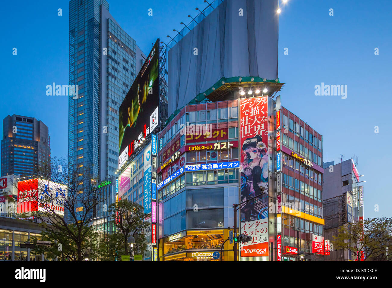 The bright lights of Shibuya Crossing at night in the Shibuya district ...