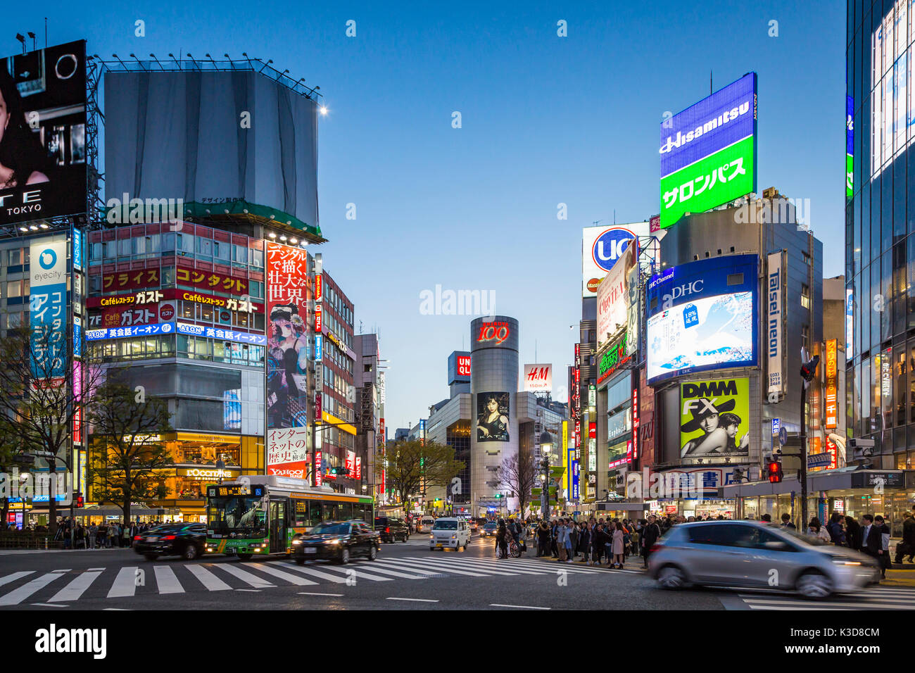 The bright lights of Shibuya Crossing at night in the Shibuya district ...
