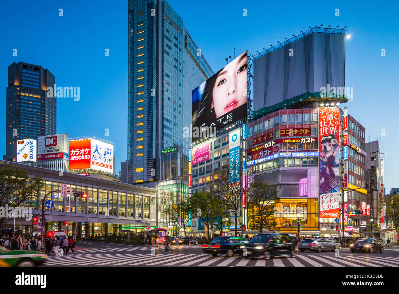 The bright lights of Shibuya Crossing at night in the Shibuya district ...