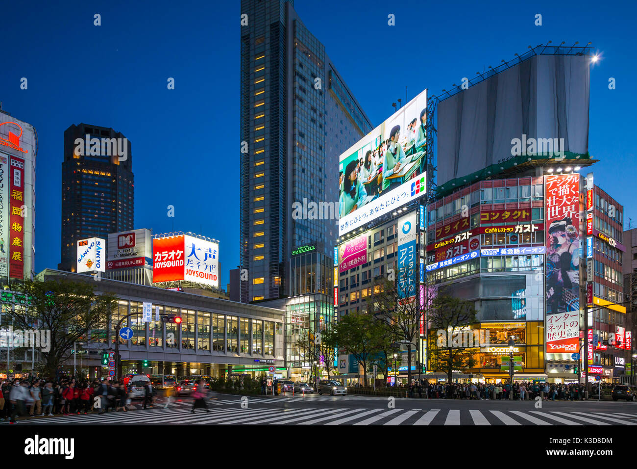 The bright lights of Shibuya Crossing at night in the Shibuya district ...