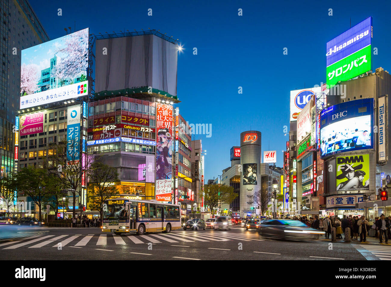 The bright lights of Shibuya Crossing at night in the Shibuya district ...