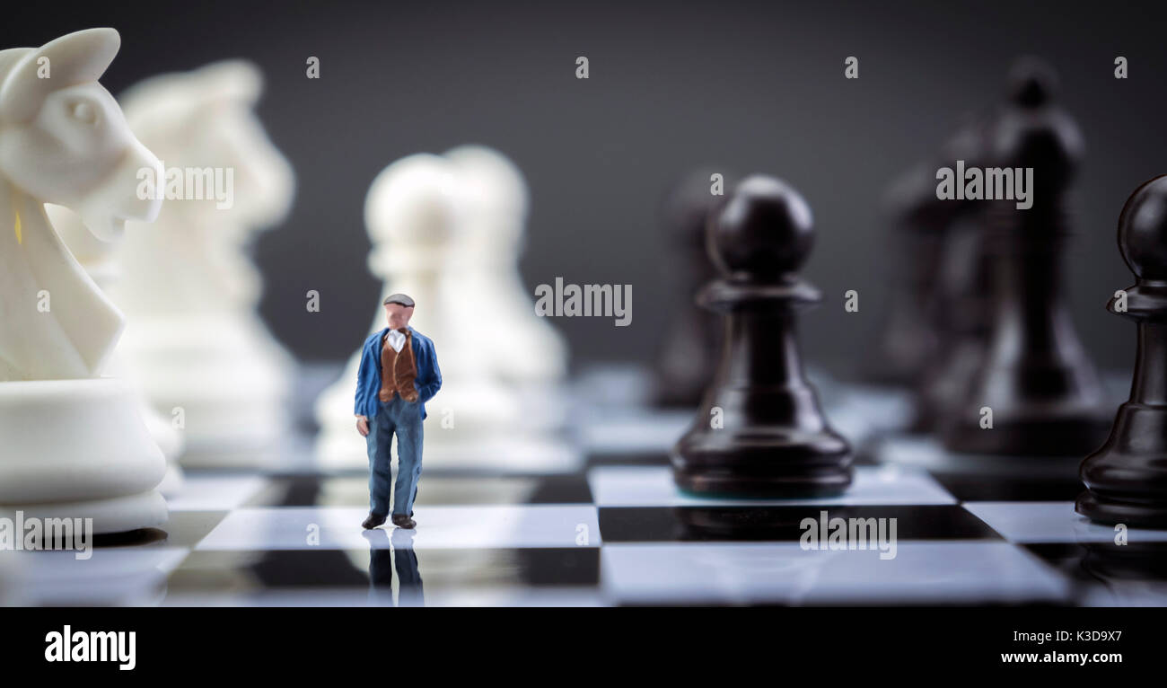 Man thumbnail within a game of chess, concept Stock Photo - Alamy
