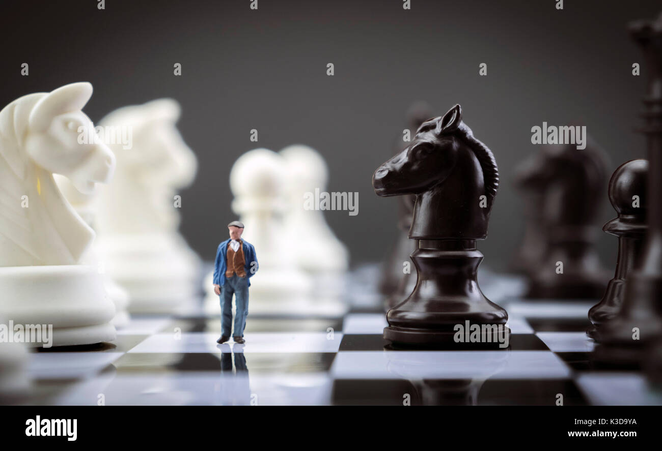 Man thumbnail within a game of chess, concept Stock Photo - Alamy