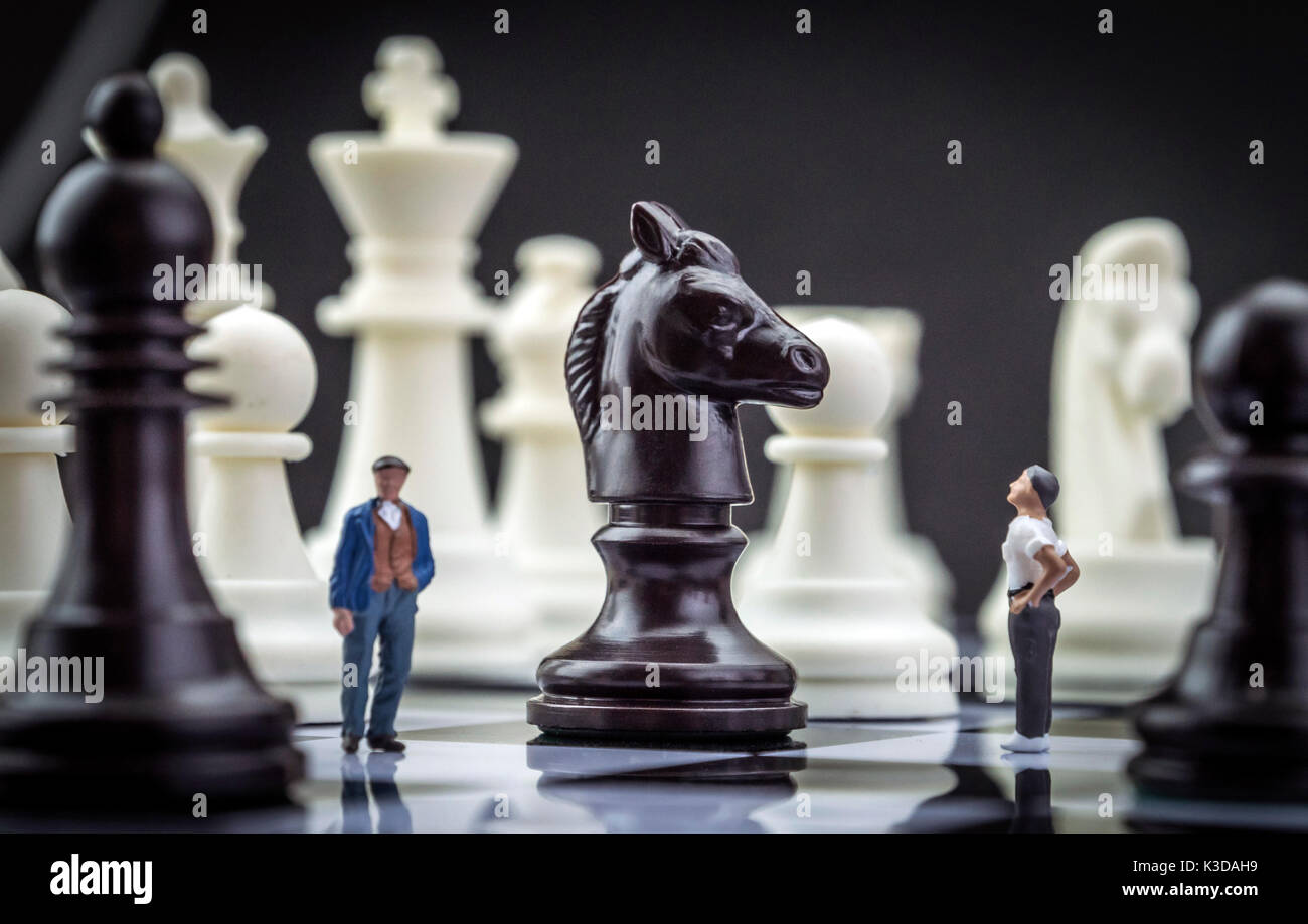 Men thumbnail within a game of chess, concept Stock Photo - Alamy