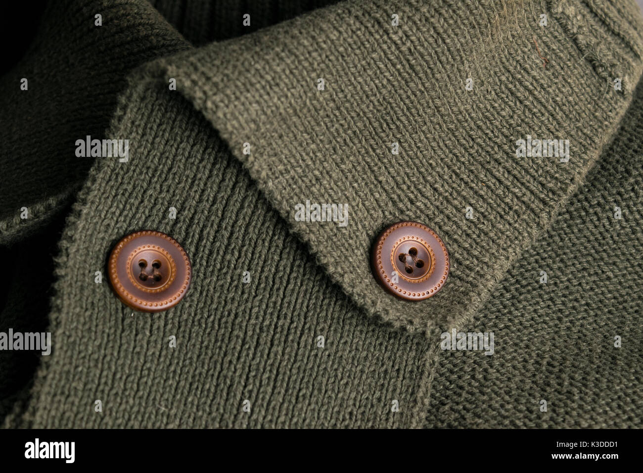 Knitted green wool jacket, made of natural wool fabrics. background ...