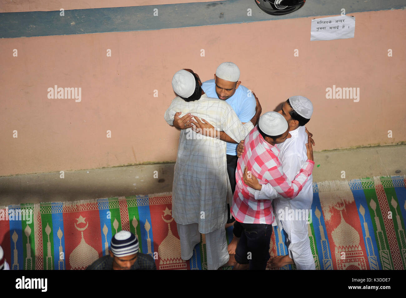 Two muslims hug hi-res stock photography and images - Alamy