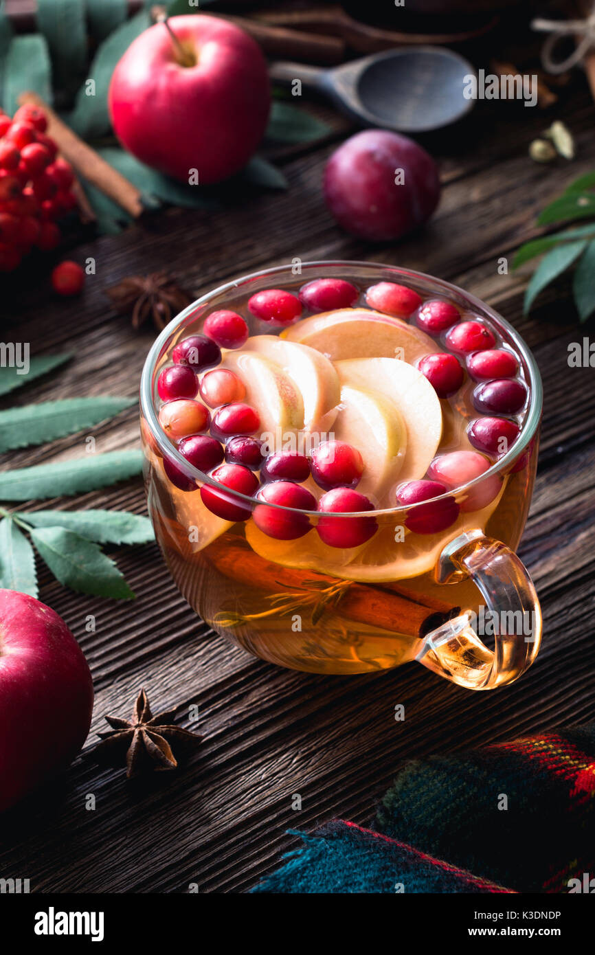 Warming winter berry tea with cranberries, apple, cinnamon, lemon ...