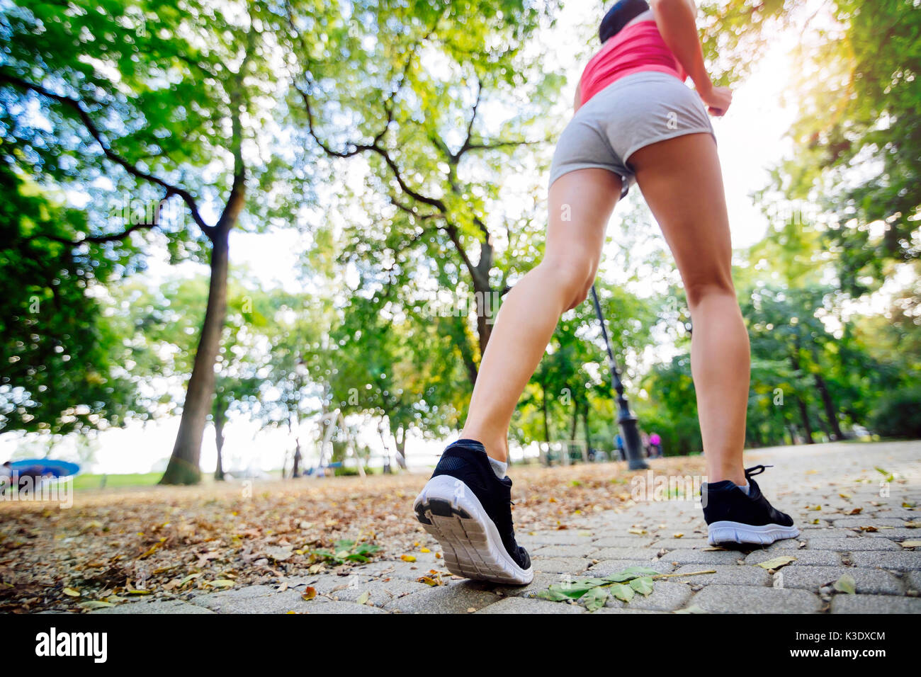 Female jogger jogging in sunshine hi-res stock photography and images ...