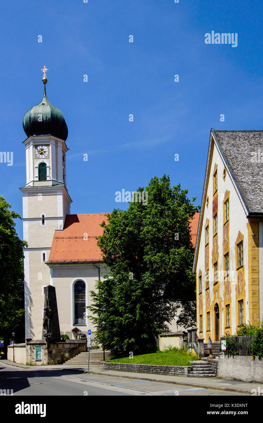 Parish church St. Peter and Paul and the old forestry office in Oberammergau, Bavaria, Germany ...