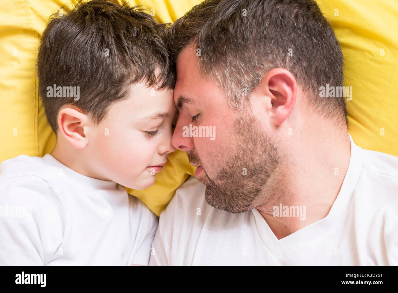 Father and son in bed, happy time Stock Photo - Alamy