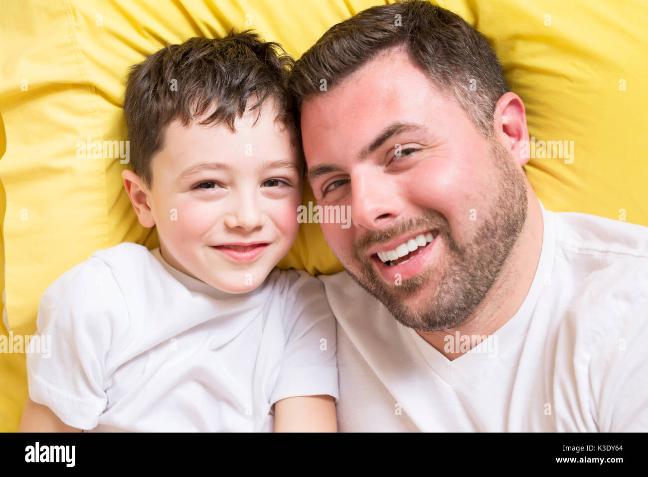 Father and son in bed, happy time Stock Photo - Alamy