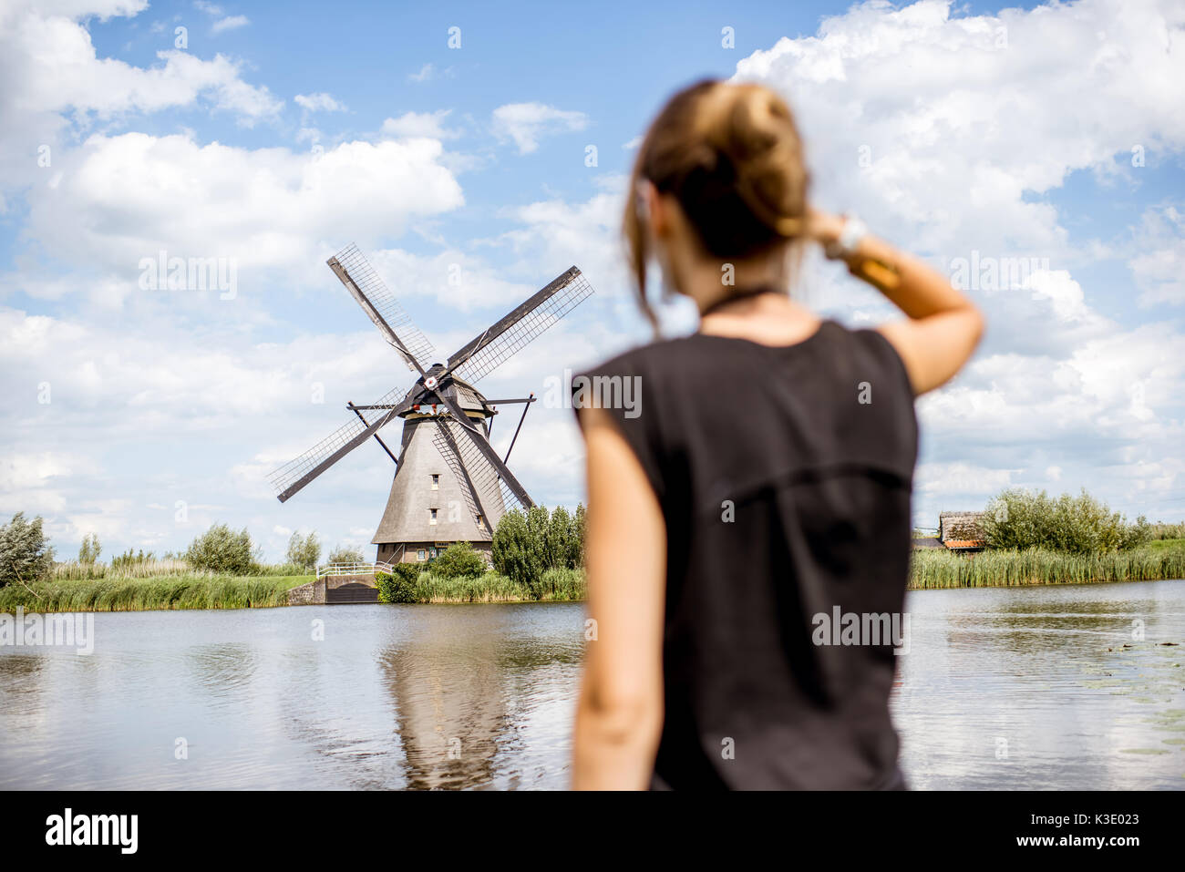 Woman in windmills field hi-res stock photography and images - Alamy