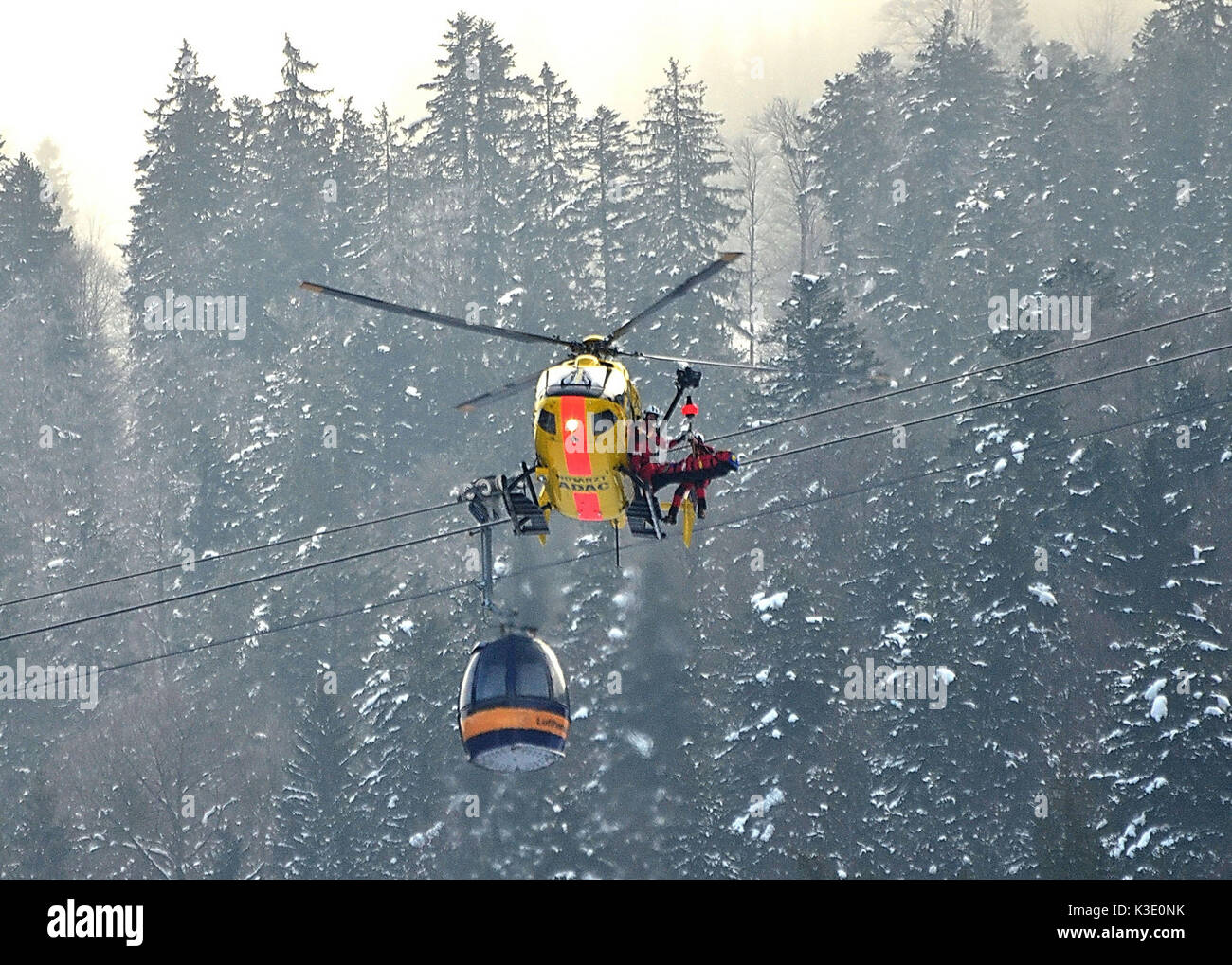 Germany, Bavaria, rescue helicopter, cable car, gondola, winter, aerial ...