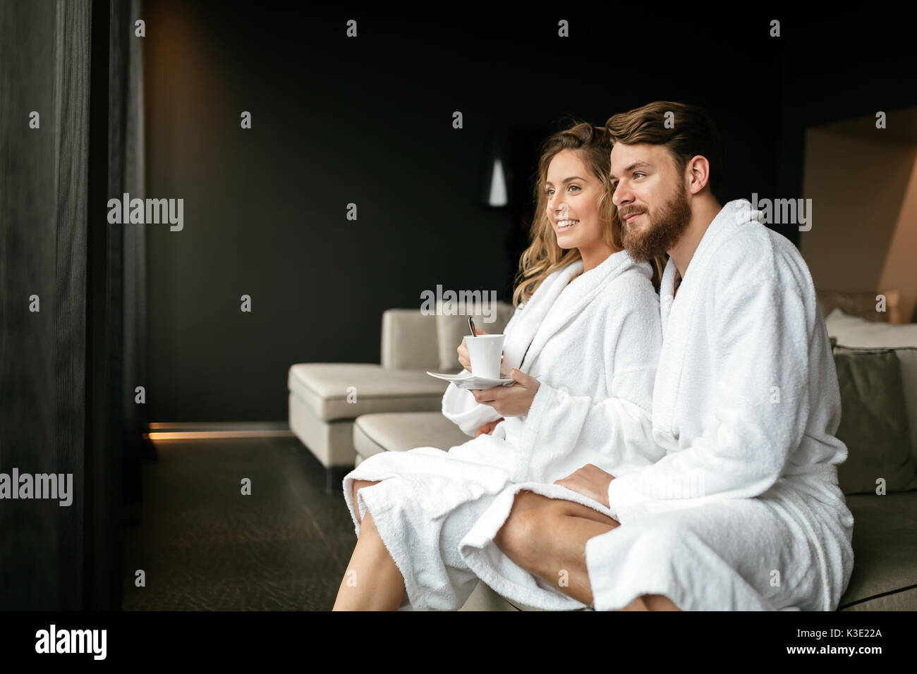 Couple enjoying morning tea Stock Photo - Alamy