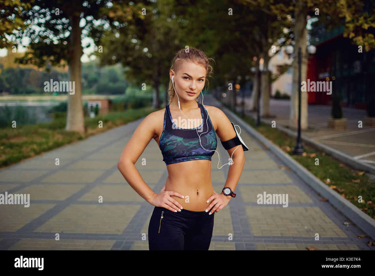 Woman running with headphones hi-res stock photography and images - Alamy