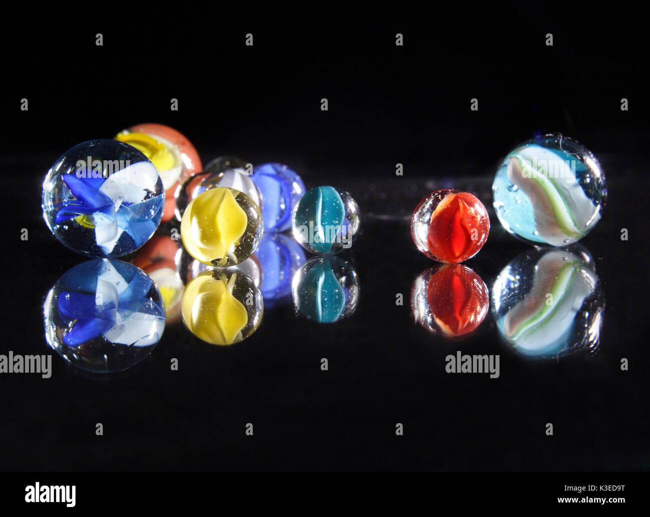 colorful glass marbles in studio Stock Photo - Alamy
