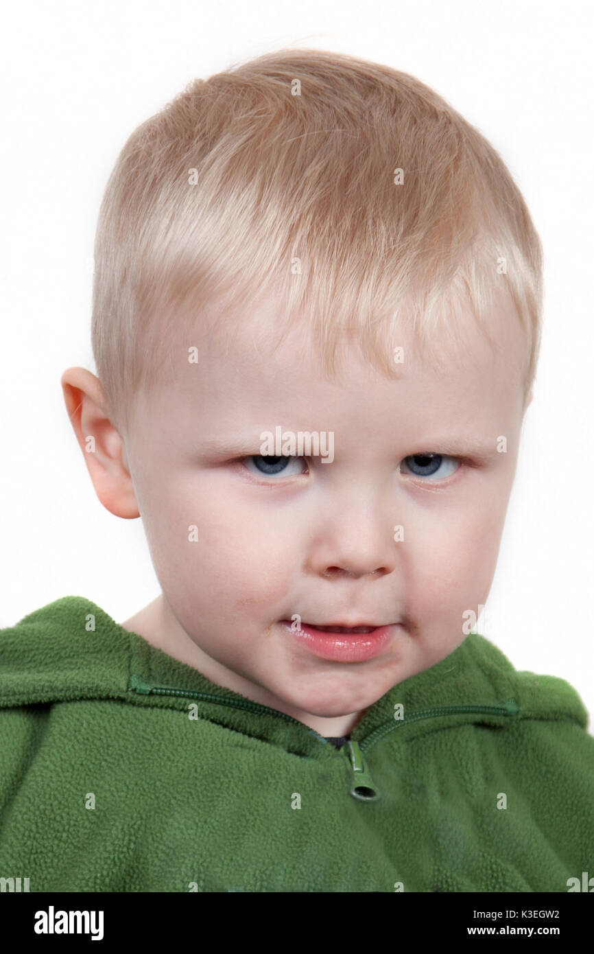 Toddler frowns angrily. Cranky face Stock Photo - Alamy