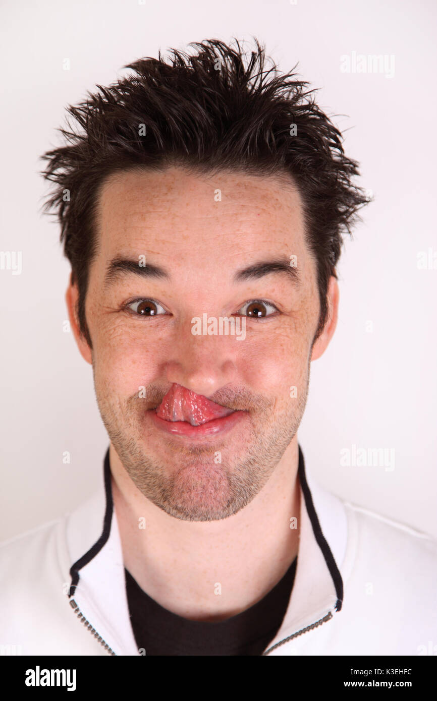 Man sticks out tongue hi-res stock photography and images - Alamy