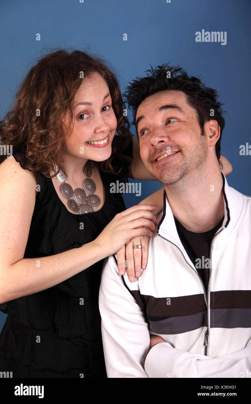 cute cheeky young couple Stock Photo - Alamy