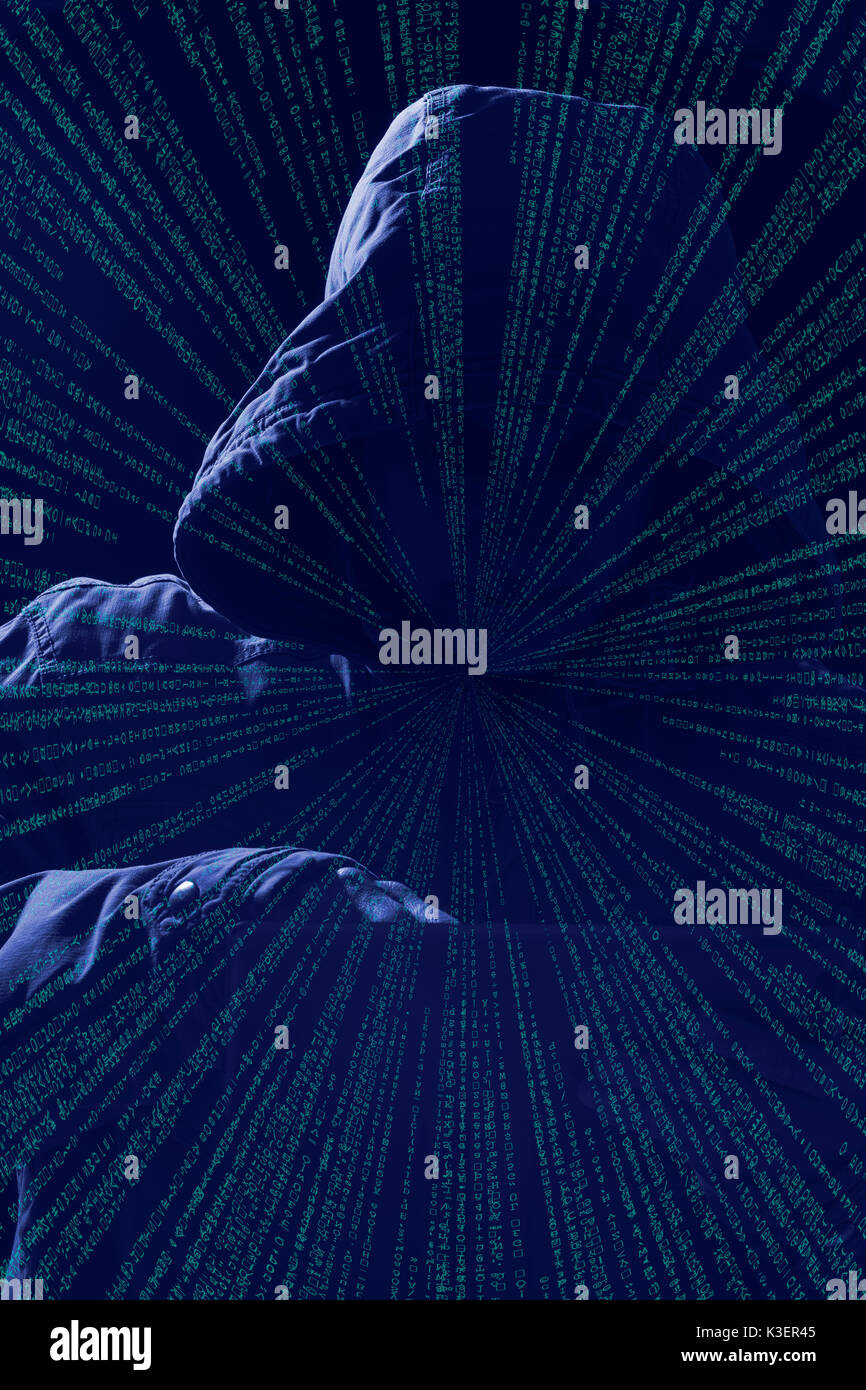 hacker silhouette with matrix code Stock Photo - Alamy