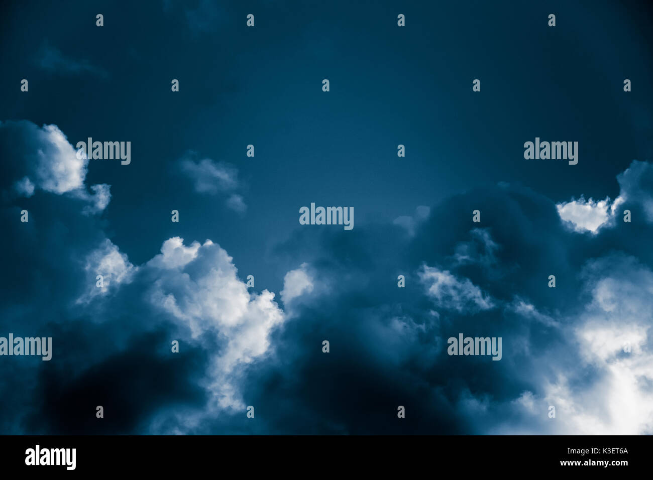 Magnificent storm clouds in the evening sky. High contrast dramatic ...