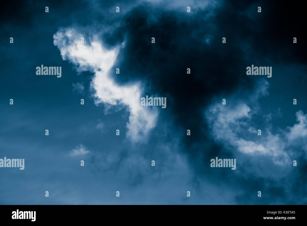 Magnificent storm clouds in the evening sky. High contrast dramatic ...