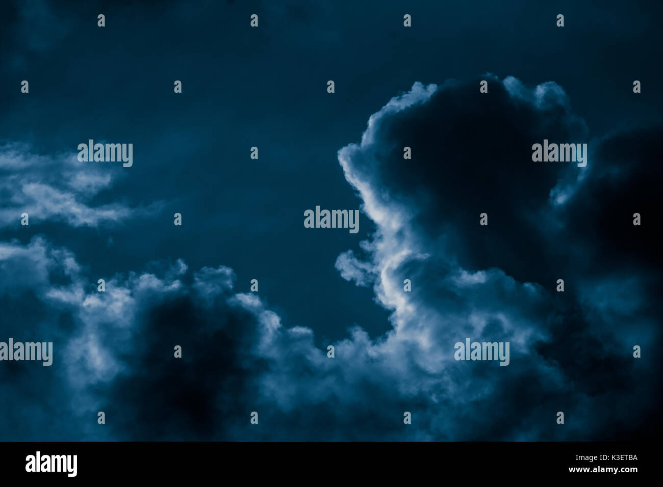 Magnificent storm clouds in the evening sky. High contrast dramatic ...