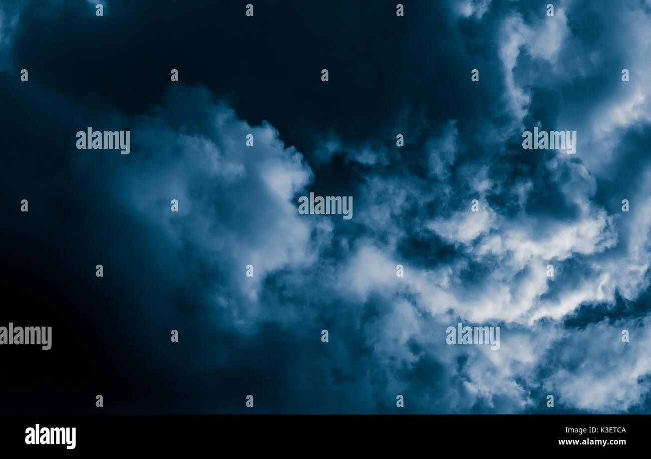 Magnificent storm clouds in the evening sky. High contrast dramatic ...