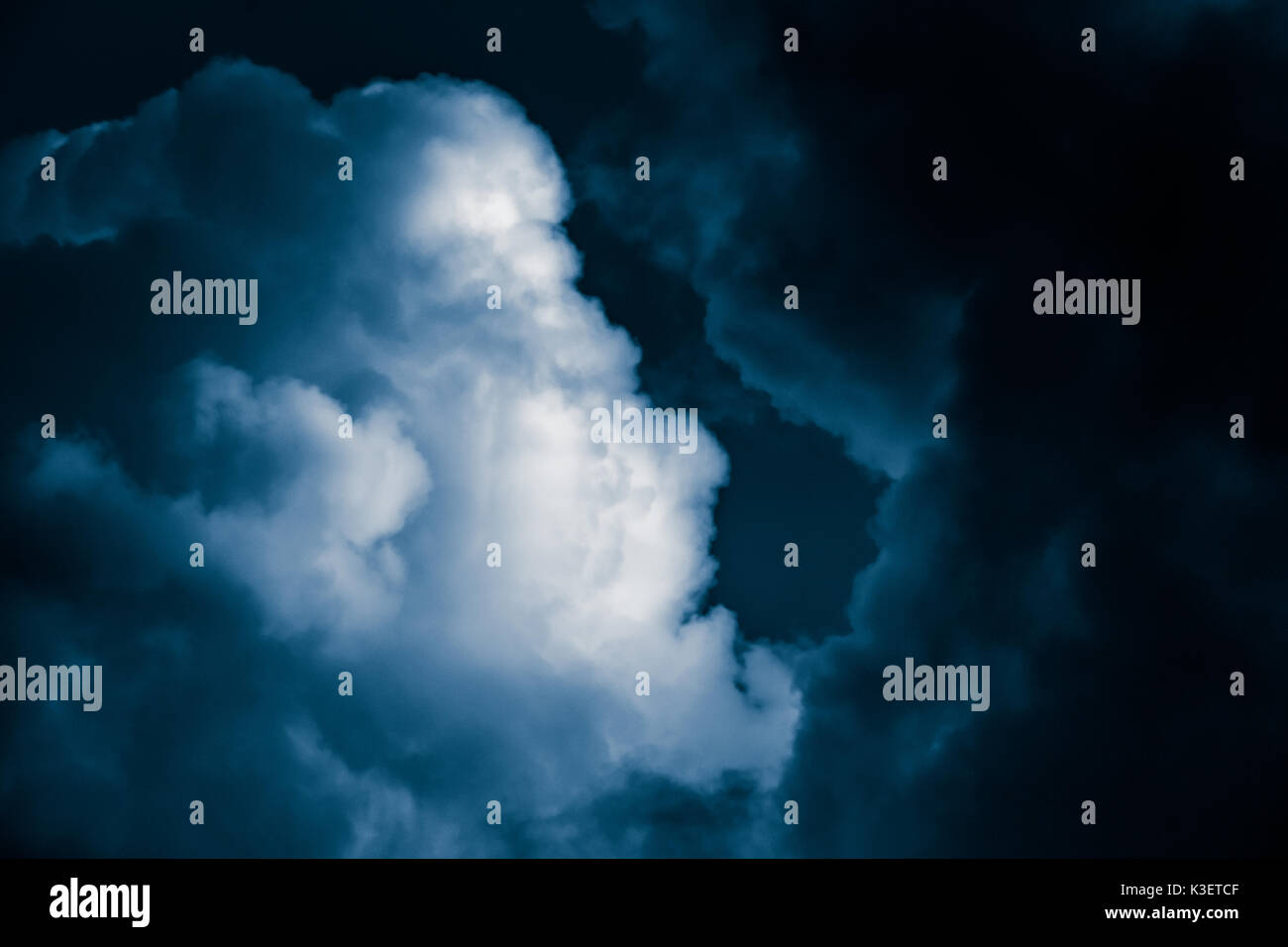 Magnificent storm clouds in the evening sky. High contrast dramatic ...