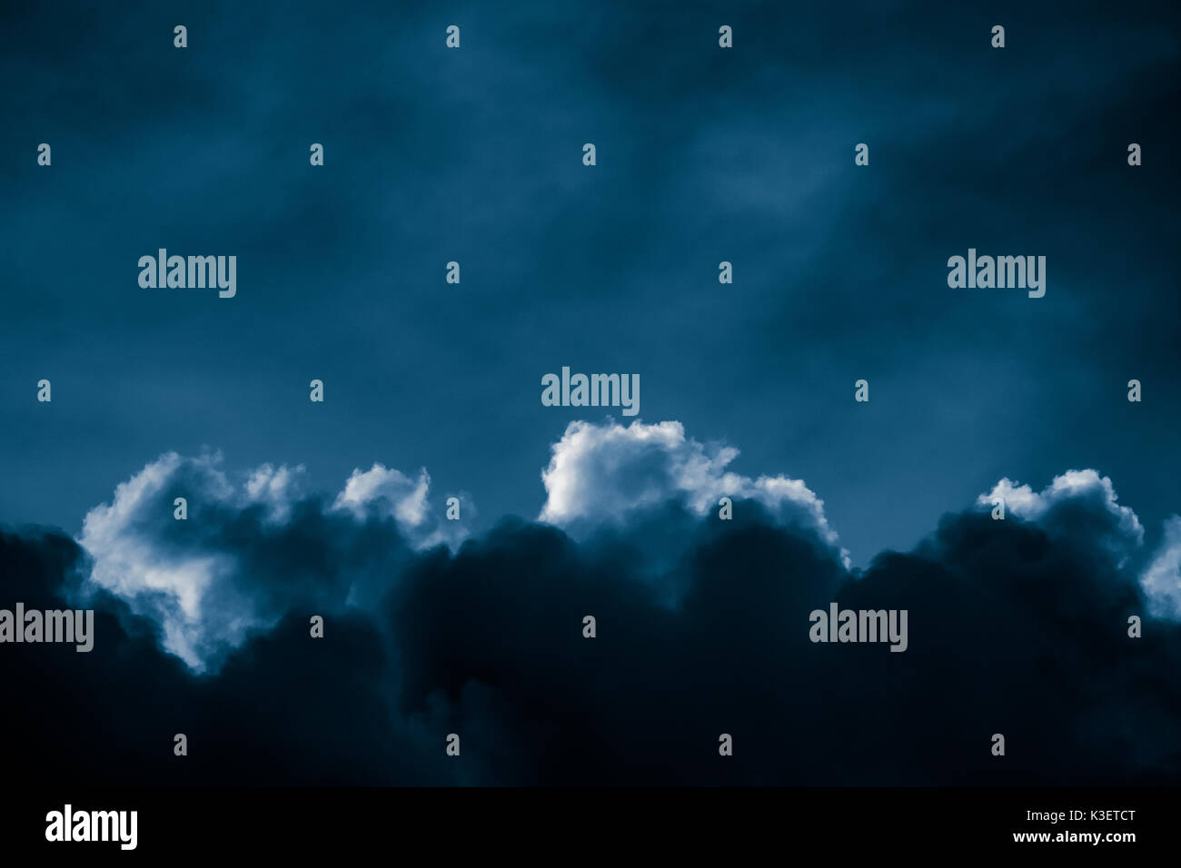 Magnificent storm clouds in the evening sky. High contrast dramatic ...