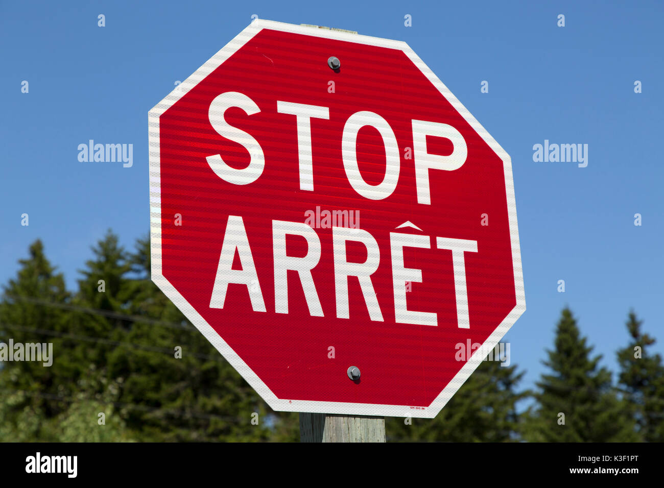 A stop sign in New Brunswick, Canada. New Brunswick is a bilingual ...