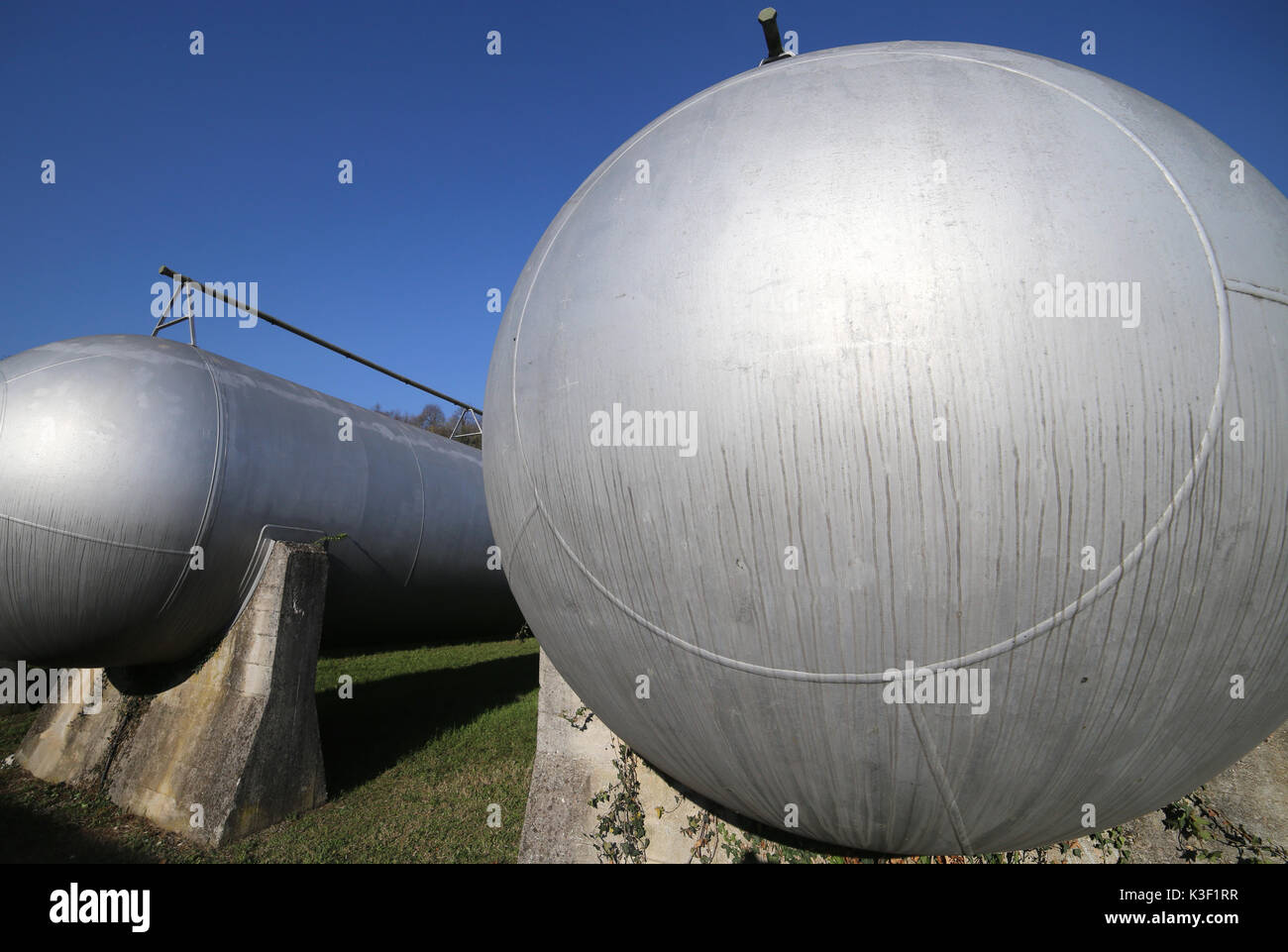 Huge gas storage tanks in an industrial area. Large cylinders are used ...