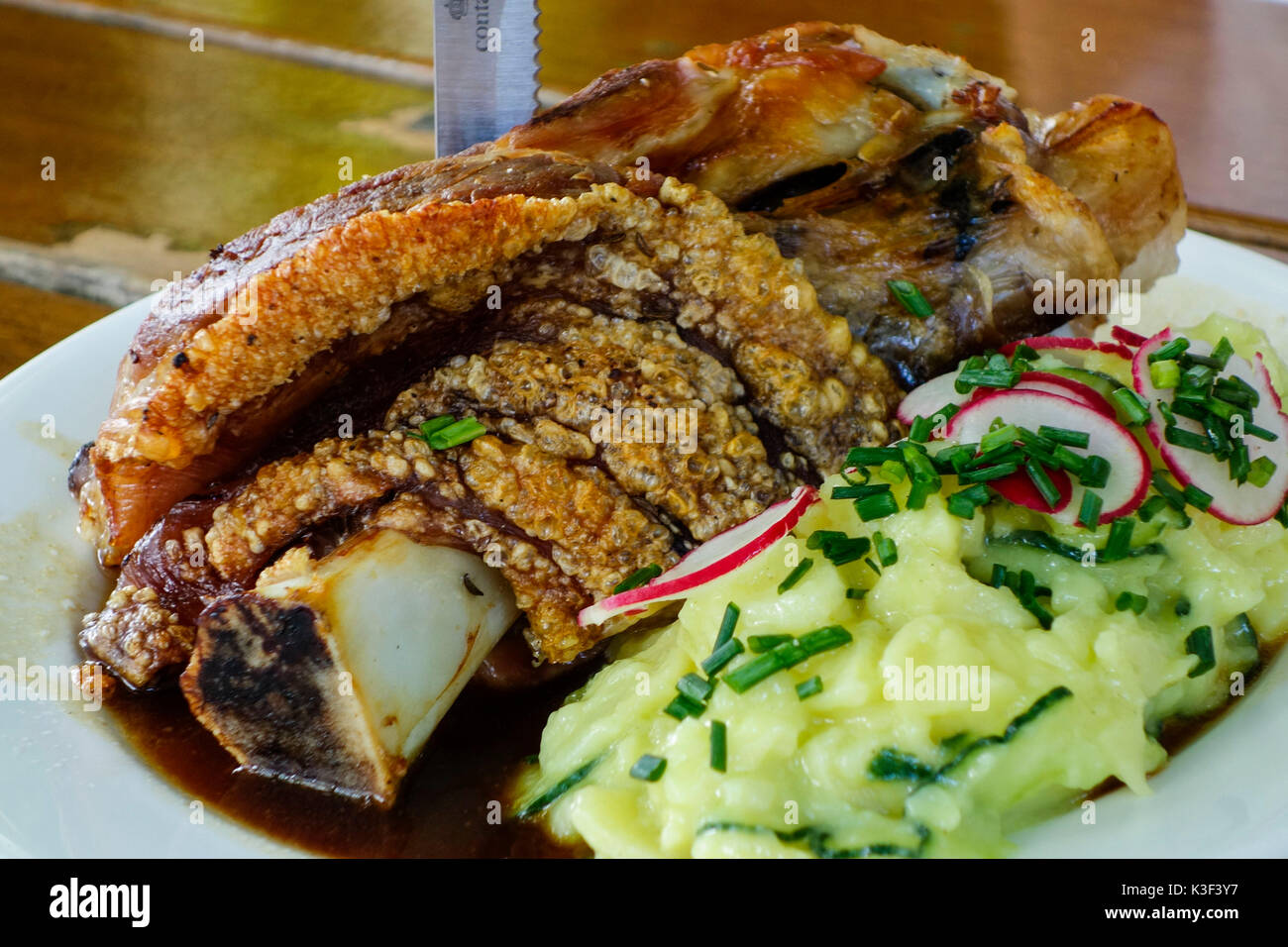 Crisply grilled knuckle of pork Stock Photo - Alamy