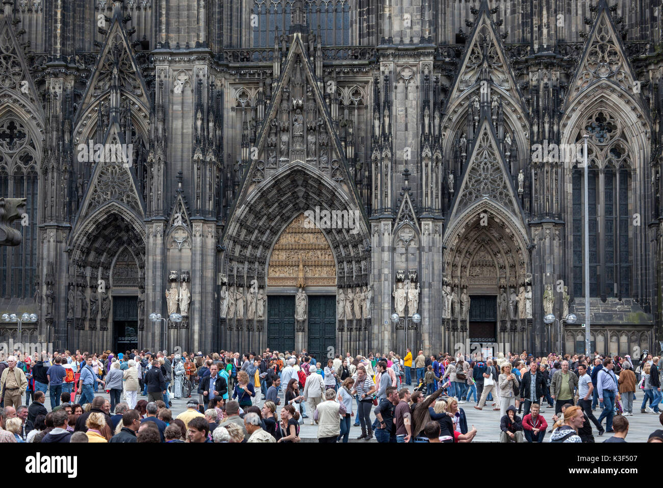 West facade of the cologne cathedral with crowd of people hi-res stock ...