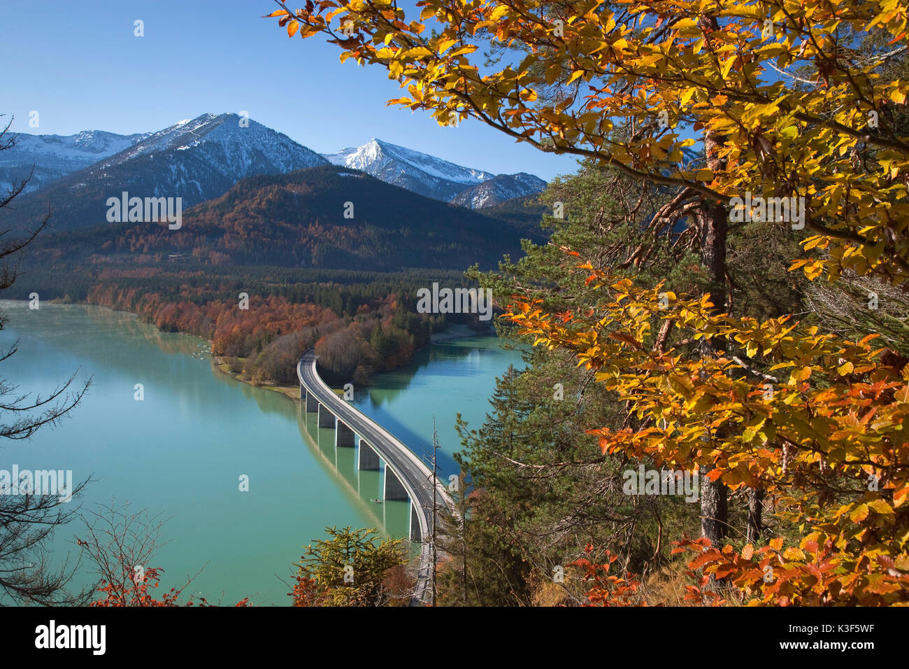 Autumnal mountain forest at the bridge at sylvenstein dam hi-res stock ...