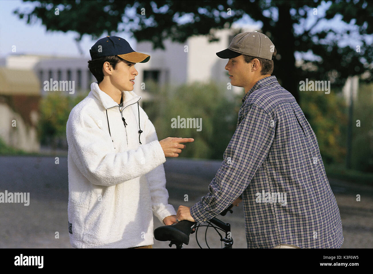 Two young men at the conversation Stock Photo - Alamy