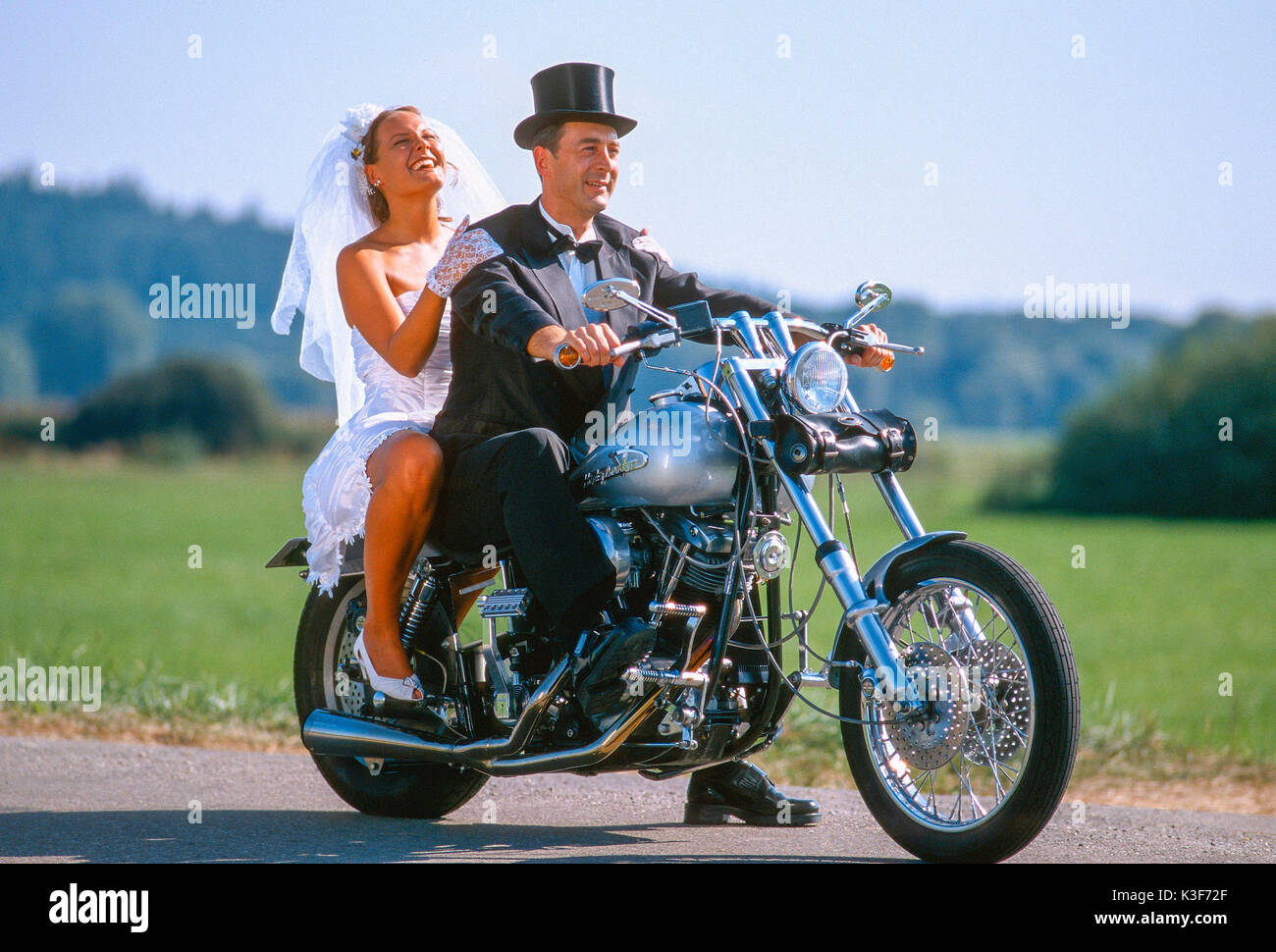 Bride And Groom On Motorcycle
