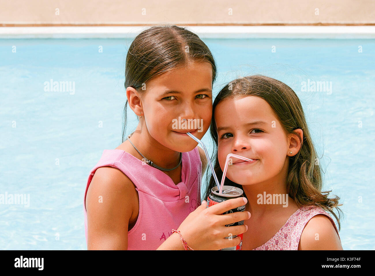 Two children drink water from hi-res stock photography and images - Alamy