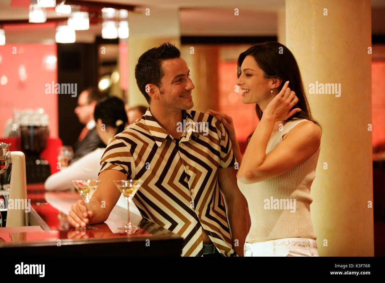 Couple at the bar close drink Stock Photo - Alamy